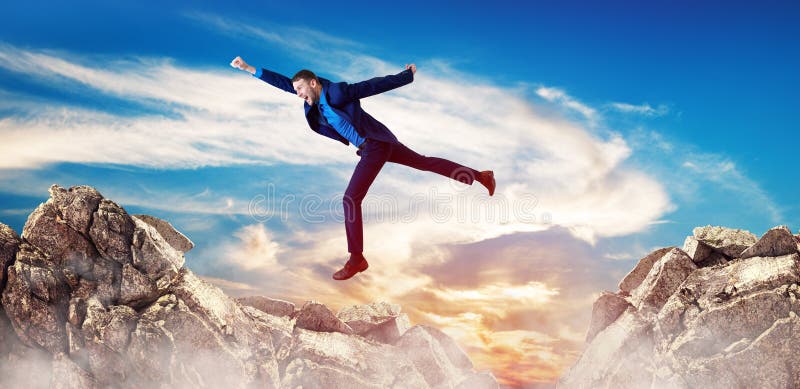 Young Businessman Flying through the Gap among Mountains. Stock Image ...