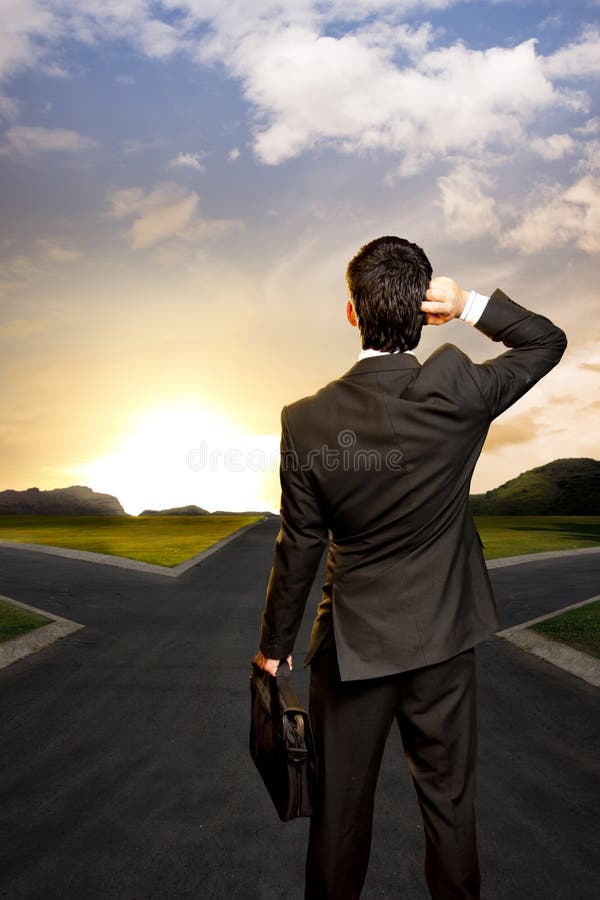 Young Businessman in Front of a Crossroad Stock Image - Image of ...