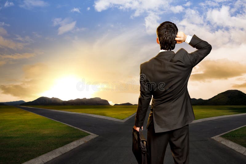 Young Businessman in Front of a Crossroad Stock Image - Image of ...