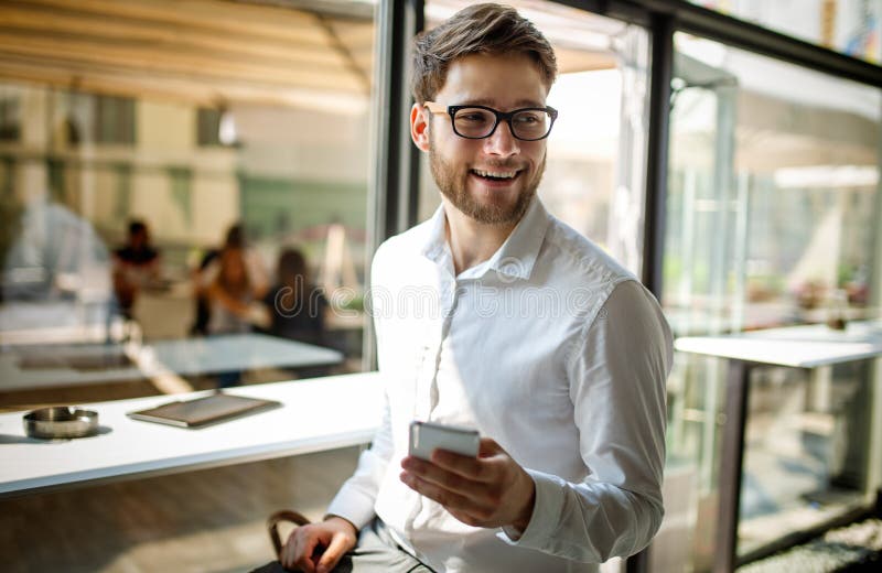 Young Businessman Having Coffee and Doing His Work in Cafe. People ...