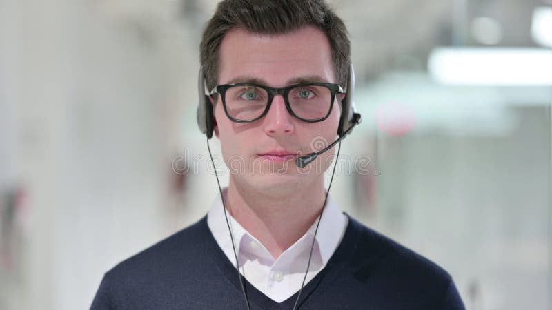 Young Businessman with Headset Looking at the Camera Stock Image ...