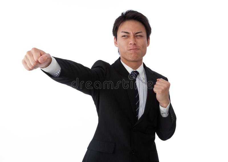 Young Businessman Hitting a Straight Punch Stock Photo - Image of ...