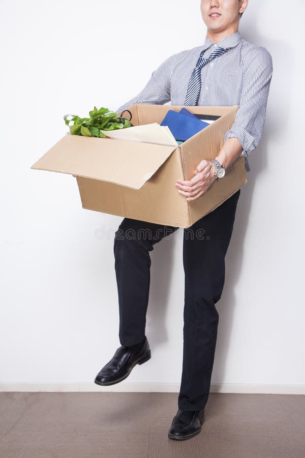 Young Businessman Holding Box of Office Items Stock Photo - Image of ...