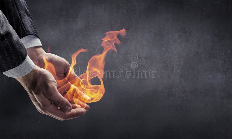 Fire burning in his hands stock photo. Image of adult - 108772532