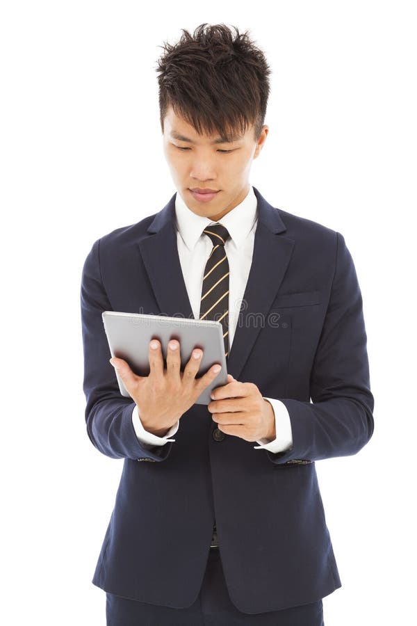 Young Businessman Holding a Tablet and Watching Screen Stock Photo ...