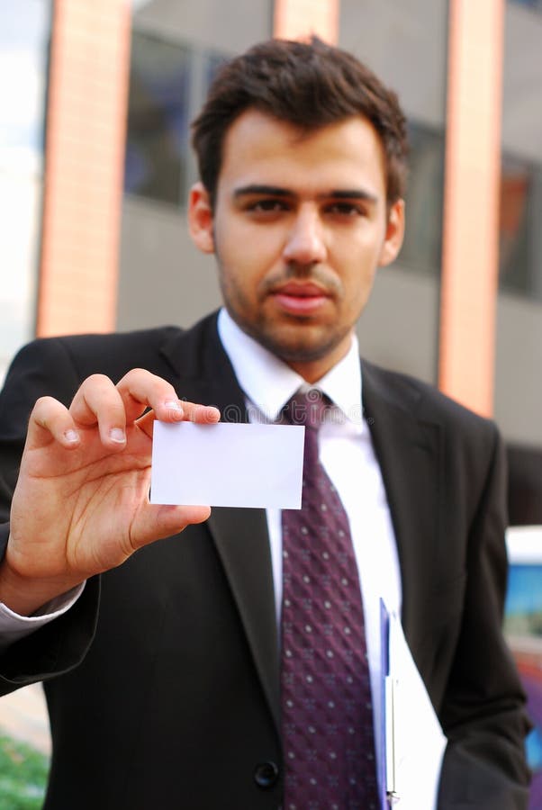 Young Businessman Holding Visit Card Stock Photo - Image of attractive ...