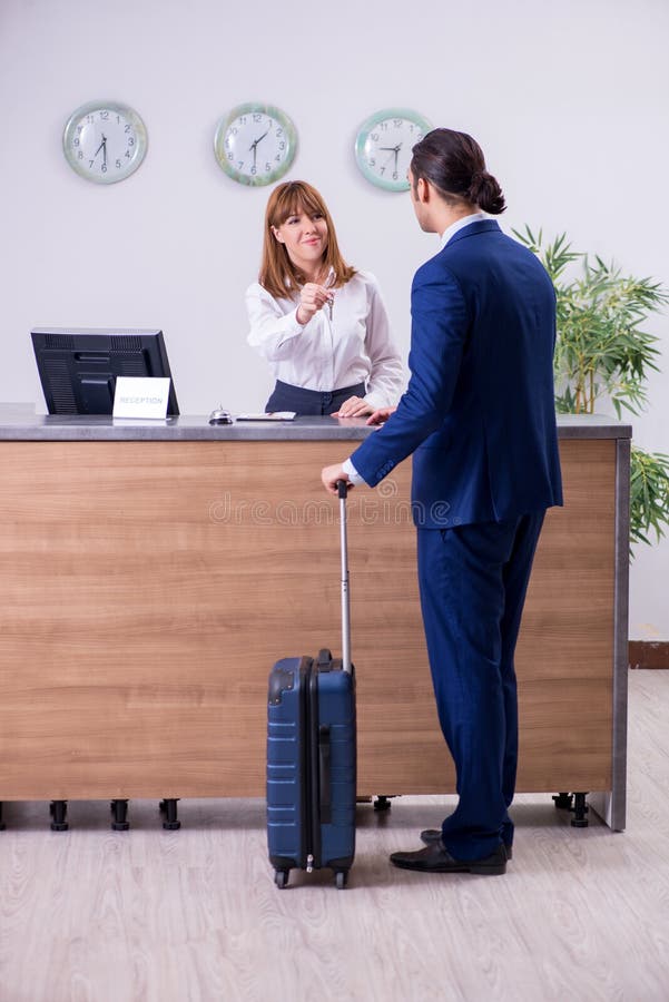 Young Businessman at Hotel Reception Stock Image - Image of hostel ...