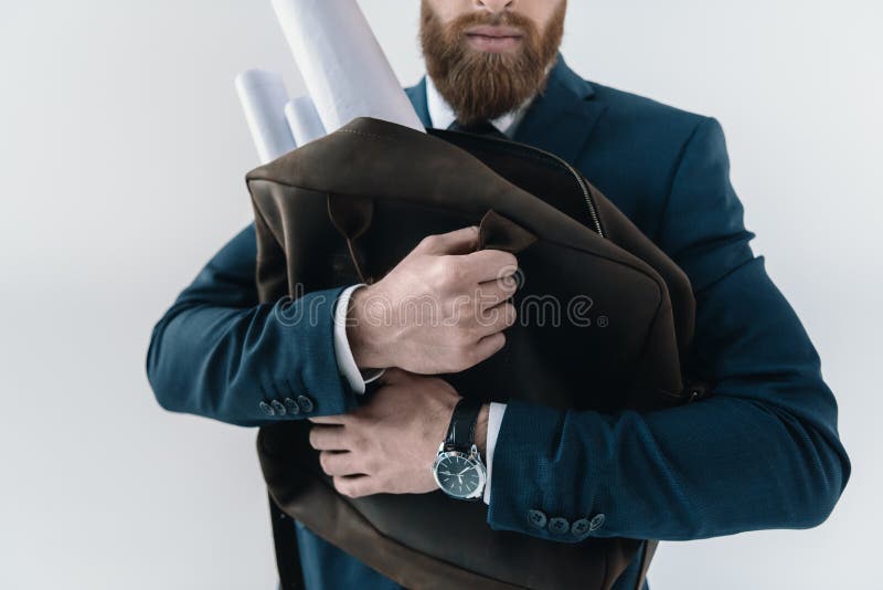 Young Businessman Hugging Bag with Rolled Blueprints Stock Photo ...