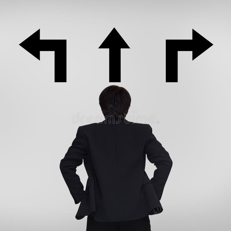 Young Businessman Looking at Arrows Stock Image - Image of male, path ...