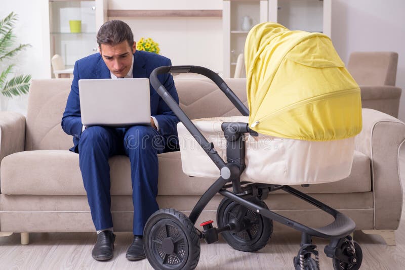 Young Businessman Looking after Baby Stock Image - Image of family ...