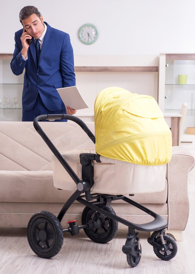 Young Businessman Looking after Baby Stock Image - Image of business ...