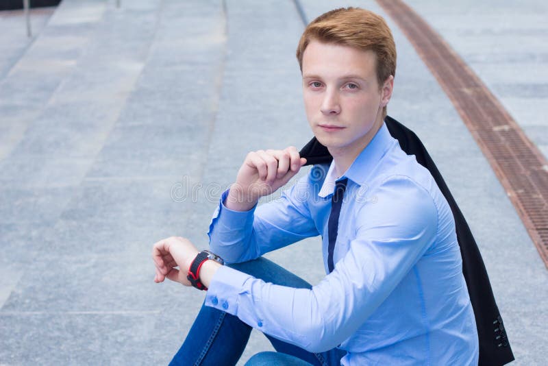 Young Businessman Looking at the Clock and Waiting for the Client Stock ...