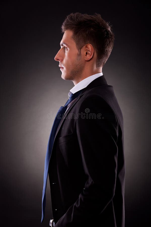 Handsome Man in a Business Suit on a Dark Background Stock Image ...