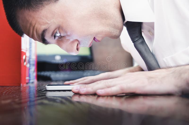 Young Businessman Looking at Phone in Shock Stock Photo - Image of ...
