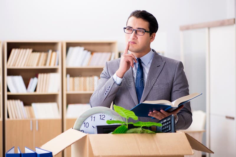 The Young Businessman Moving Offices after Being Made Redundant Stock ...
