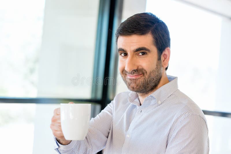 Young Businessman in Office with a Mug Stock Photo - Image of ...
