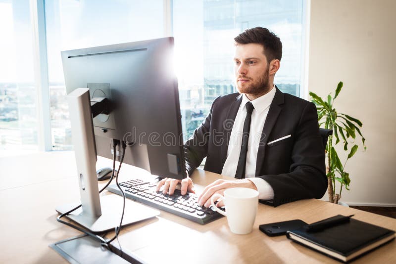Young Businessman in Office Sitting at His Desk Stock Image - Image of ...
