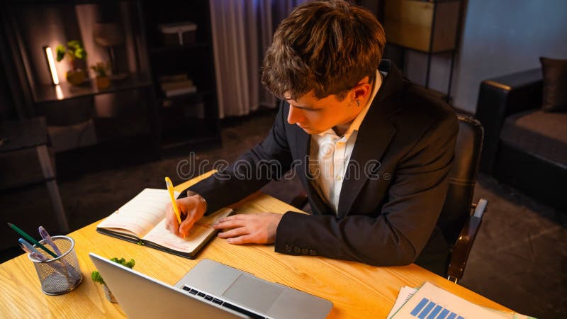 Young Businessman in the Office Working Late at Evening, Man Sitting at ...