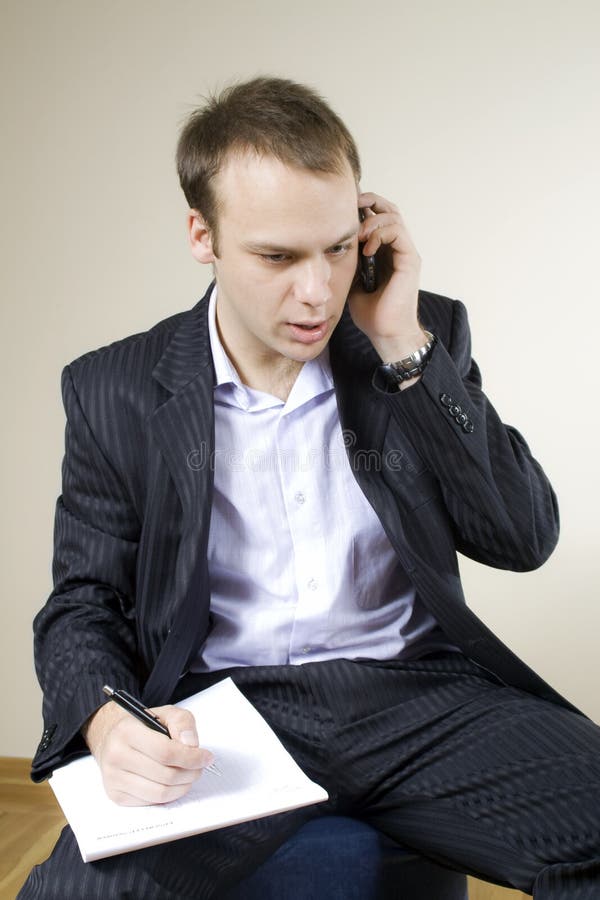 Young Businessman on the Phone Taking Notes Stock Photo - Image of ...