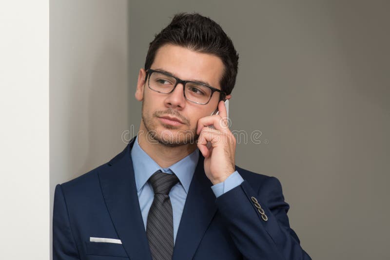Young Businessman on the Phone Stock Photo - Image of confident, office ...