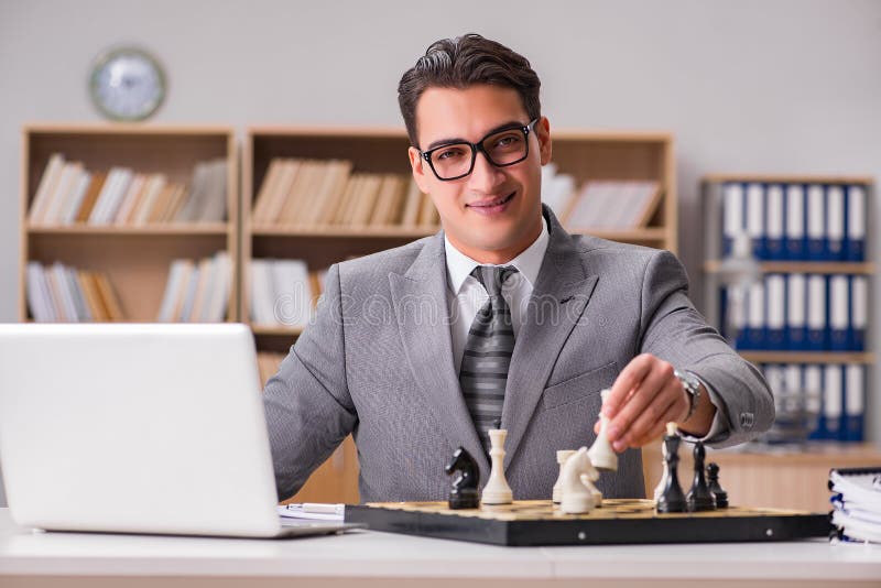 The Young Businessman Playing Chess in the Office Stock Image - Image ...