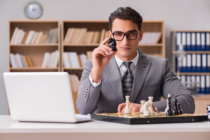 The Young Businessman Playing Chess in the Office Stock Photo - Image ...