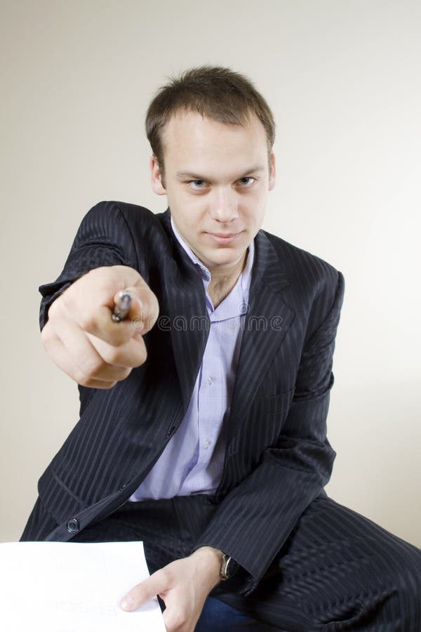 Young Businessman Pointing His Pen in the Camera Stock Photo - Image of ...