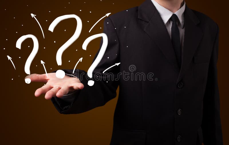Young Businessman Presenting Hand Drawn Question Marks Stock Photo ...