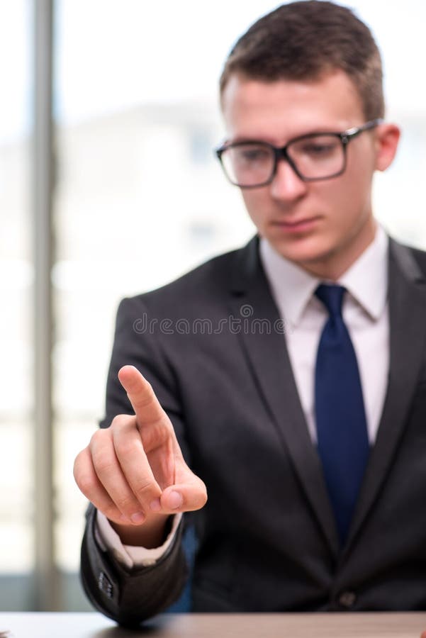 The Young Businessman Pressing Buttons in Business Concept Stock Image ...