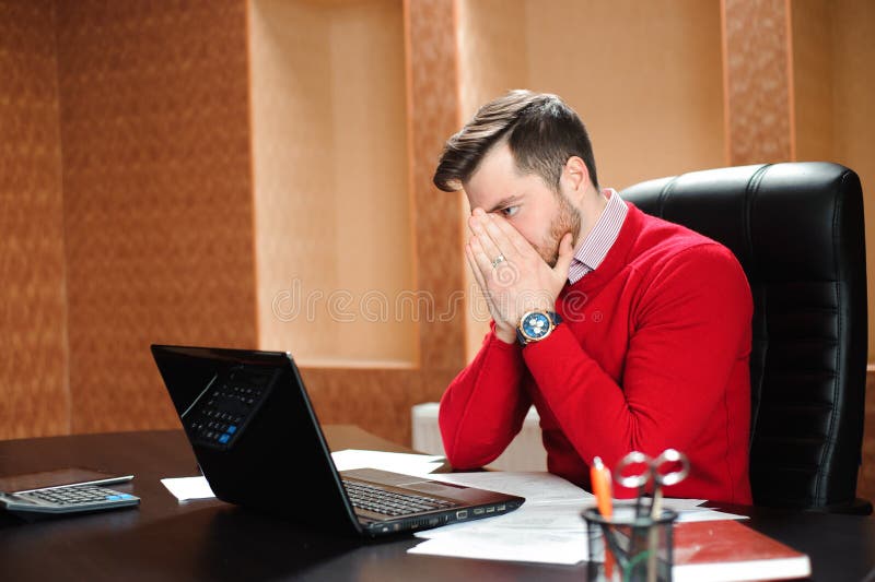 Young Businessman with a Problem at the Office Sitting at His Desk ...