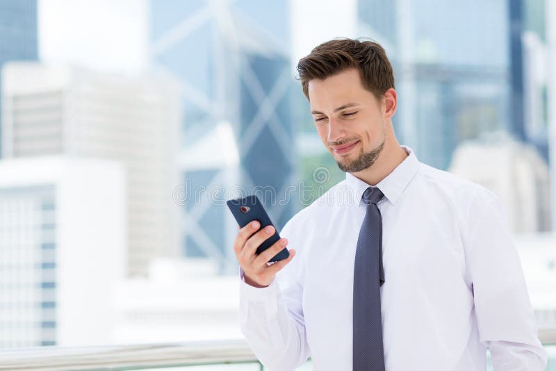 Young Businessman Read on the Cellphone Stock Photo - Image of ...