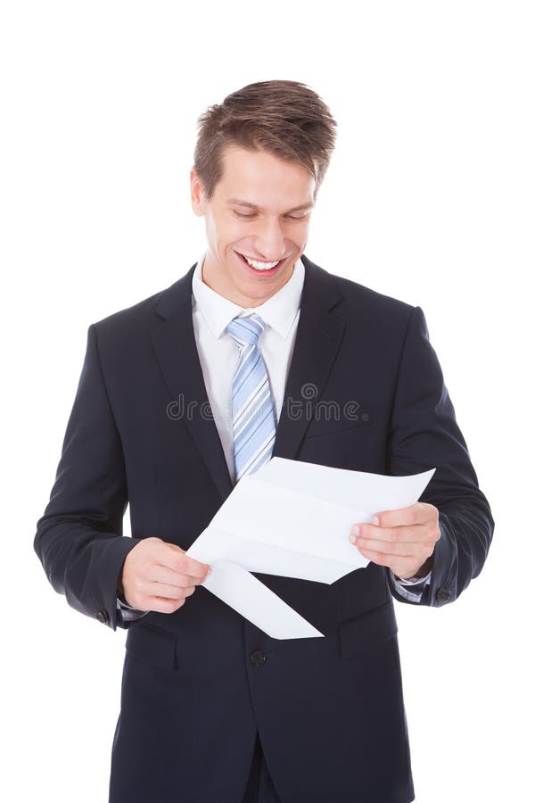 Young Businessman Reading Document Over White Background Stock Photo ...