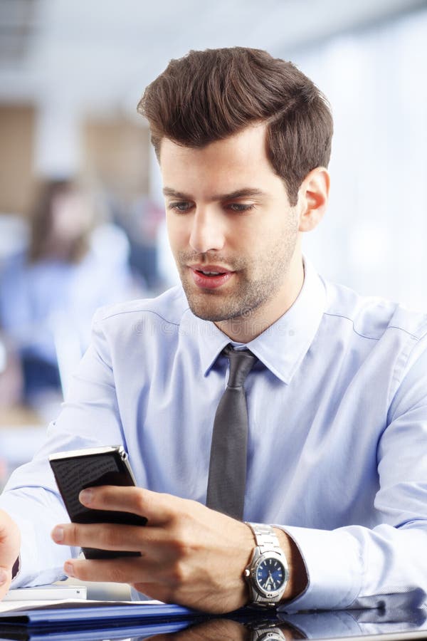Young Businessman Reading a Text Message Stock Image - Image of message ...