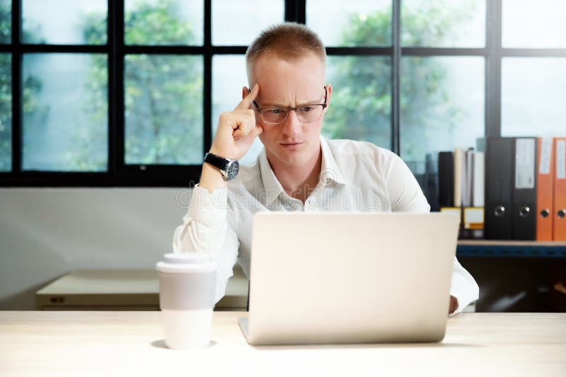 Young Businessman Seriously Working on Computer Laptop in Office Stock ...