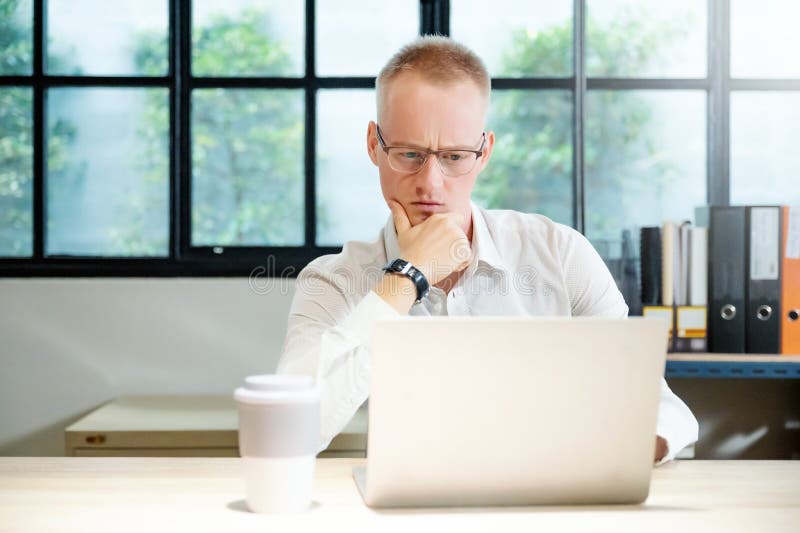 Young Businessman Seriously Working on Computer Laptop in Office Stock ...