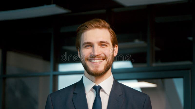 Young Businessman Smiling and Looking at Camera. Young Man in a Suit ...