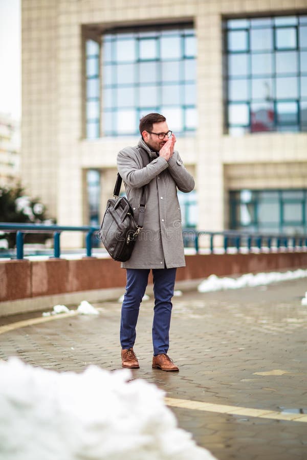 Young Businessman Standing in Front of Huge Modern Business Building ...