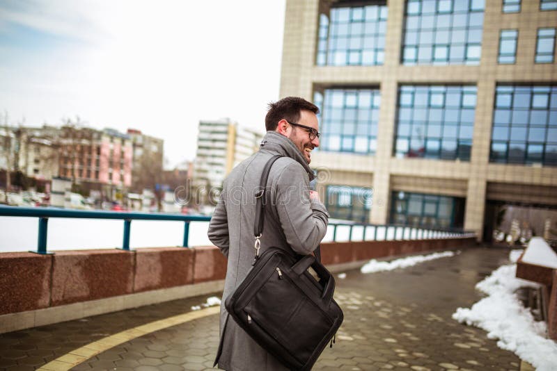Young Businessman Standing in Front of Huge Modern Business Building ...