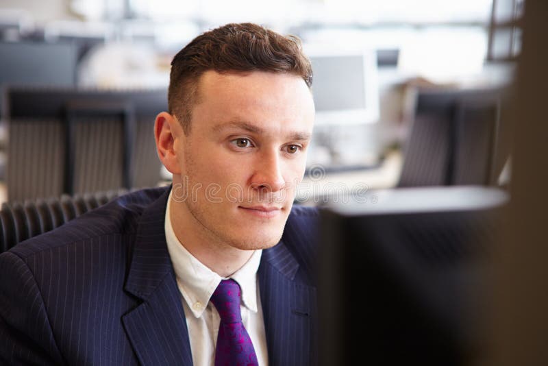 Young Businessman Staring at Computer Screen Stock Image - Image of ...