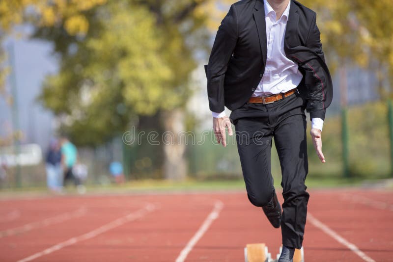 Young Businessman in Suit Running on Track Stock Image - Image of ...