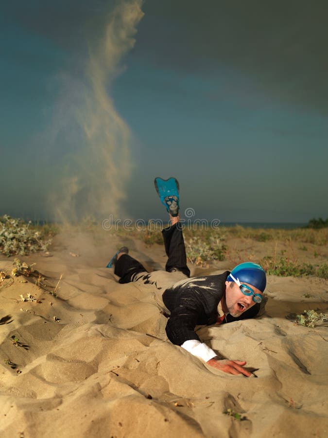 Young Businessman Swimming through Sand in Suit Stock Photo - Image of ...