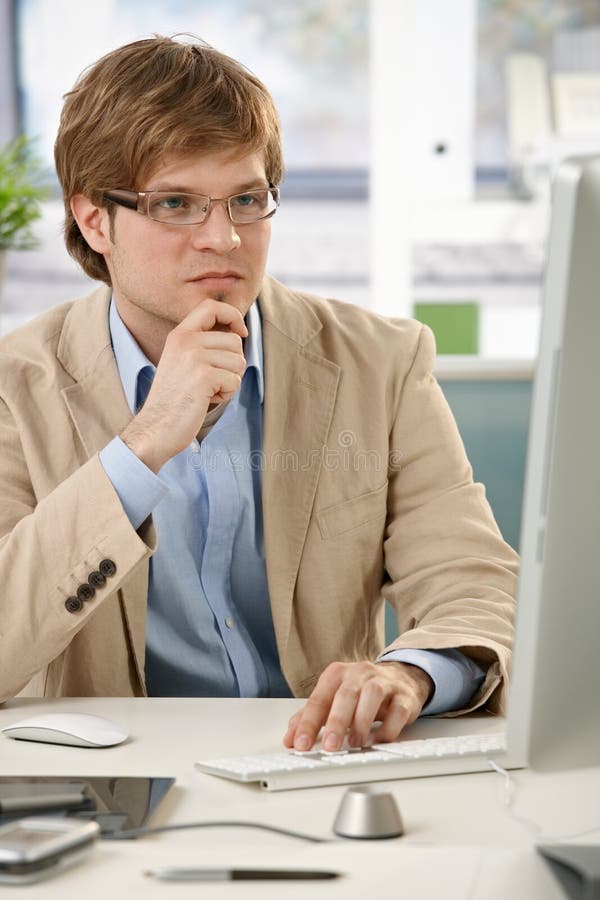 Young businessman thinking stock photo. Image of indoor - 17627994