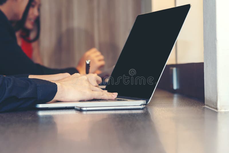 Young Businessman Training on the Computer, Sitting at the Desk with ...