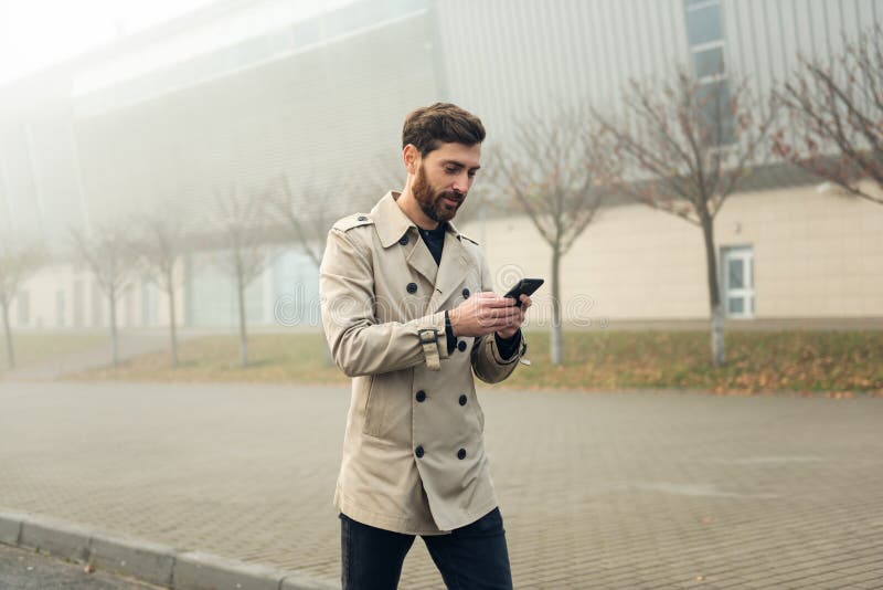 Young Businessman Typing Text Message on His Way To Work Stock Photo ...
