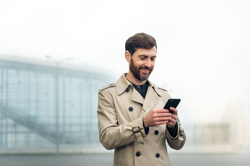 Young Businessman Typing Text Message on His Way To Work Stock Image ...