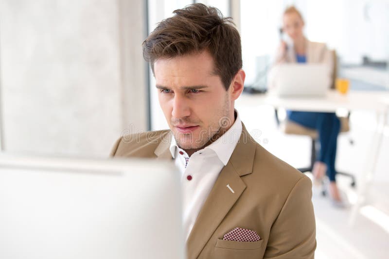 Young Businessman Using Computer in New Office Stock Image - Image of ...