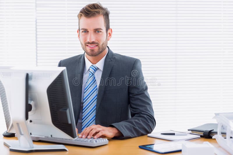 Male Office Worker Using Computer at Desk Stock Image - Image of ...