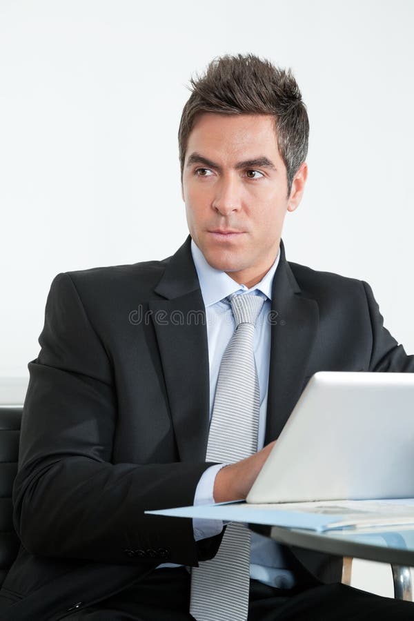 Young Businessman Using Digital Tablet in Office Stock Photo - Image of ...