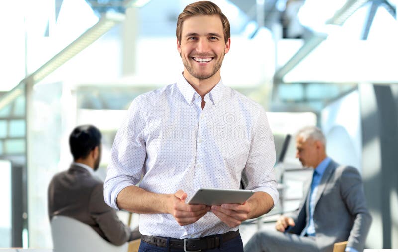 Young Businessman Using His Tablet in the Office. Stock Photo - Image ...