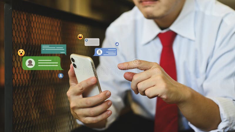 Young Businessman Using Mobile Phone with Notification Icons of Like ...